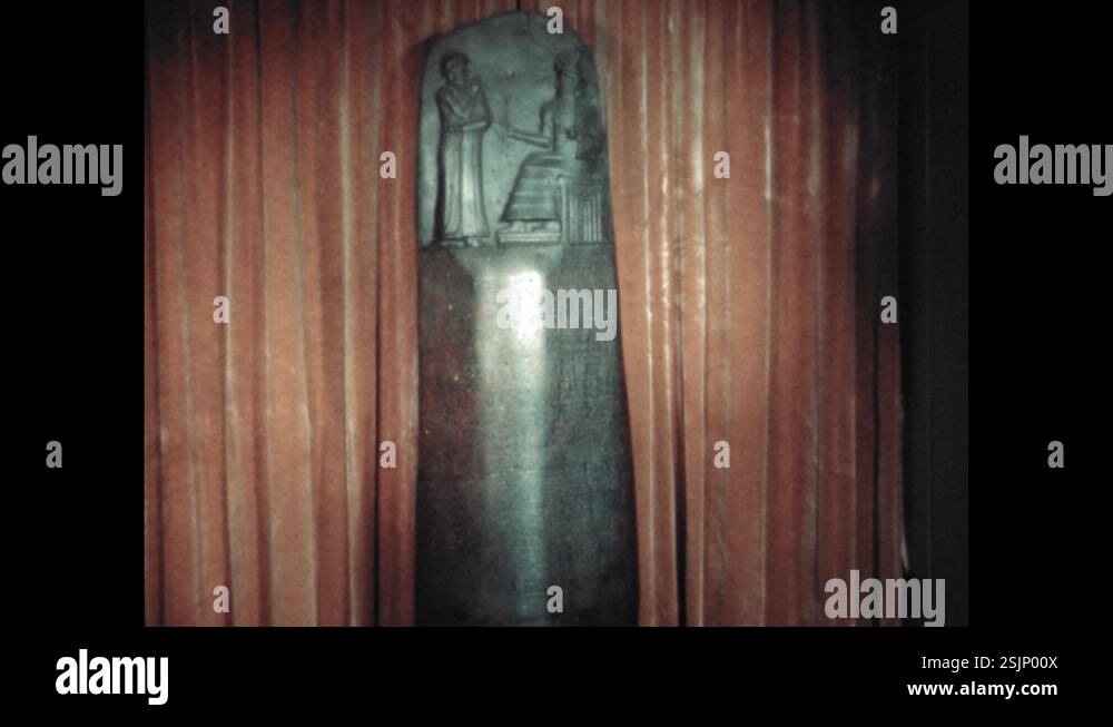 1940s: Carved stone plinth with Egyptian person sitting on throne and ...