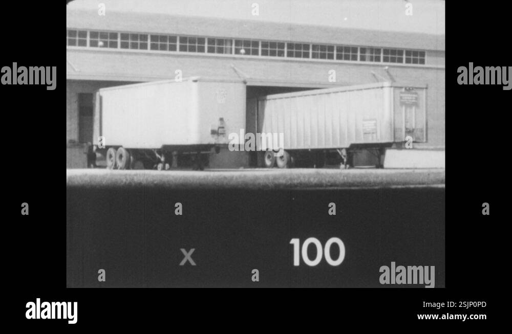 1960s: Two semitrucks sit at a loading dock. Equation appears at bottom ...