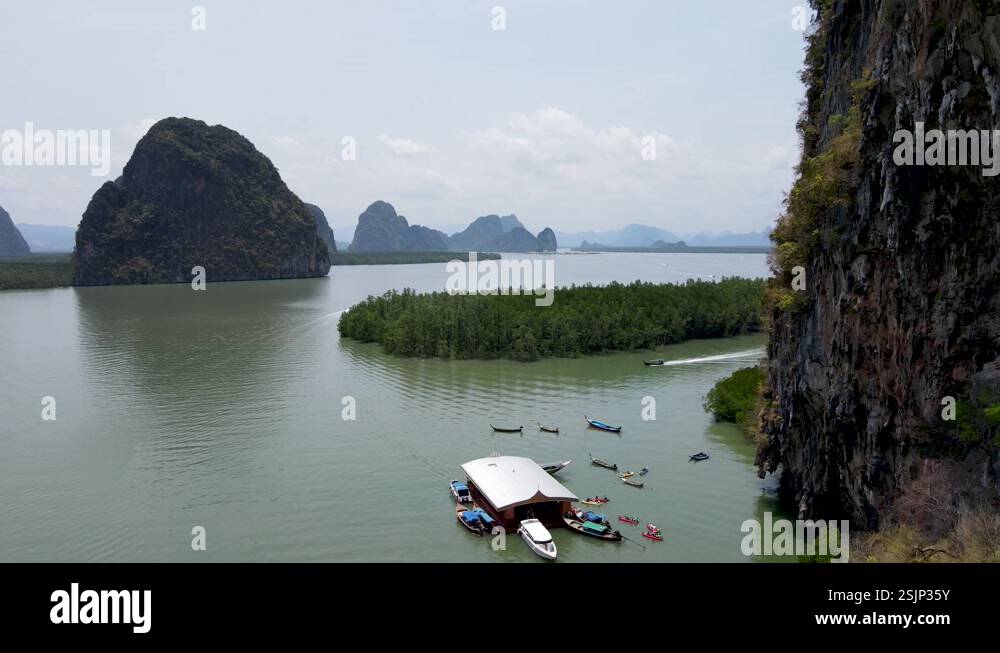 Drone footage of boats docking on a floating bar in Thailand Stock ...