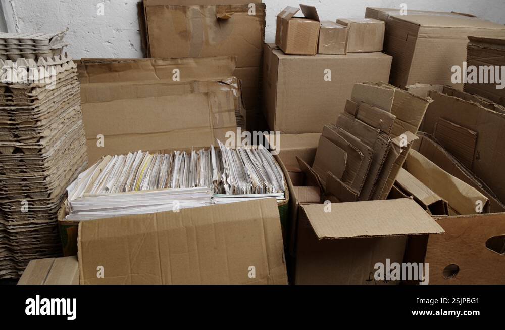 Paper waste recycle. Piles of used cardboard, packaging boxes, egg ...