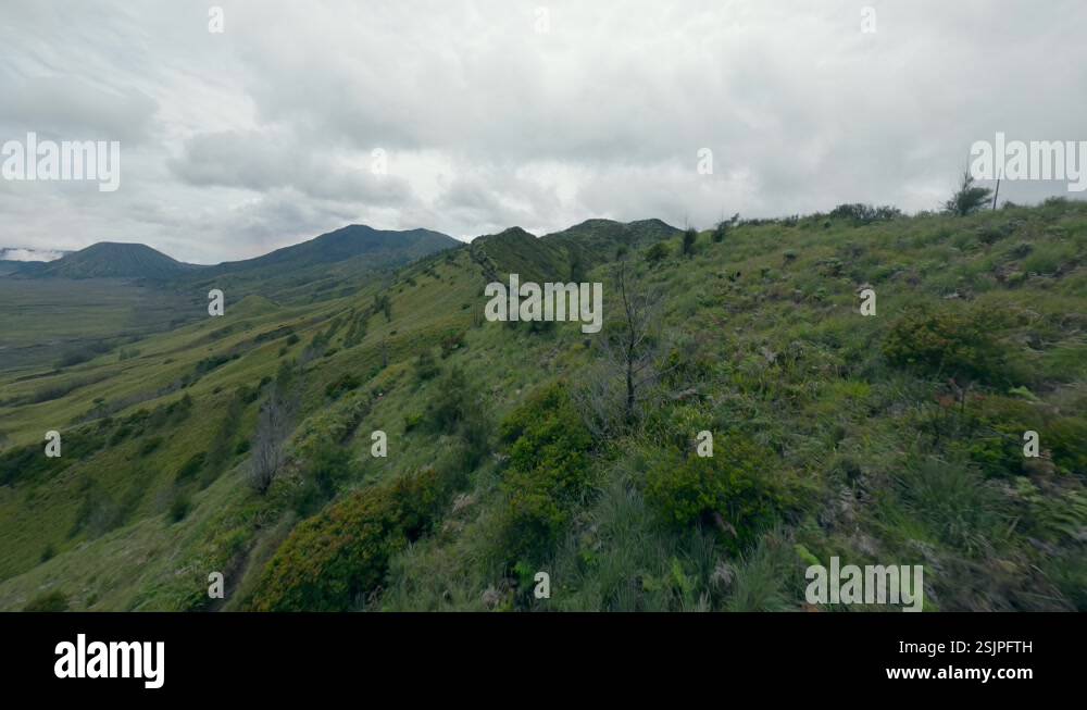 Extreme moto enduro riders group speed race on high mountain ridge dirt ...
