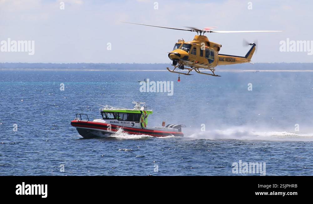 RAC Rescue Helicopter Lifting Up And Away From Marine Rescue Boat ...