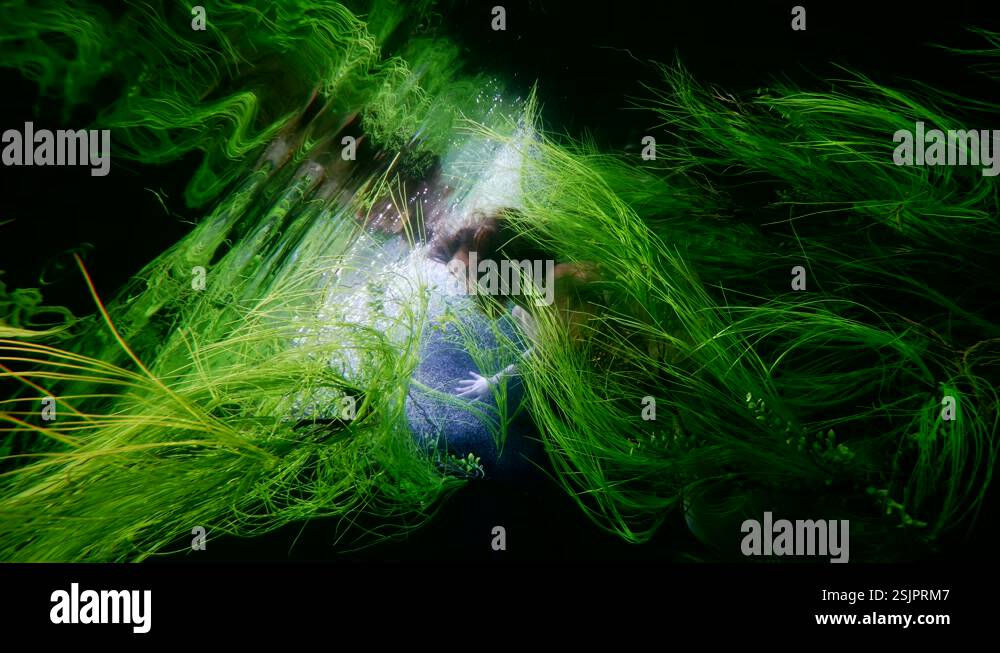 underwater fantasy and imagination, woman floating in depth with ...