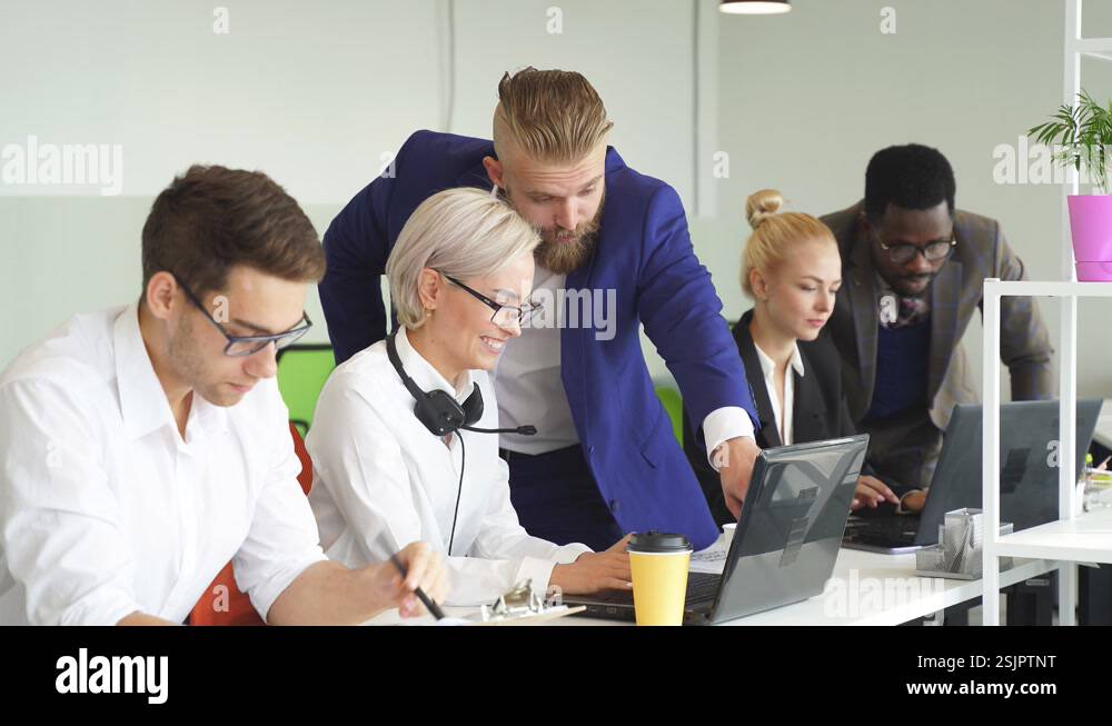 friendly team of colleagues works in the office, people in formal ...