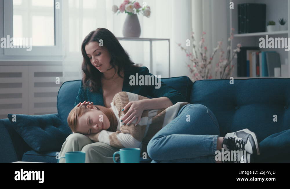 Caring mother comforting teenage daughter crying about first break-up ...