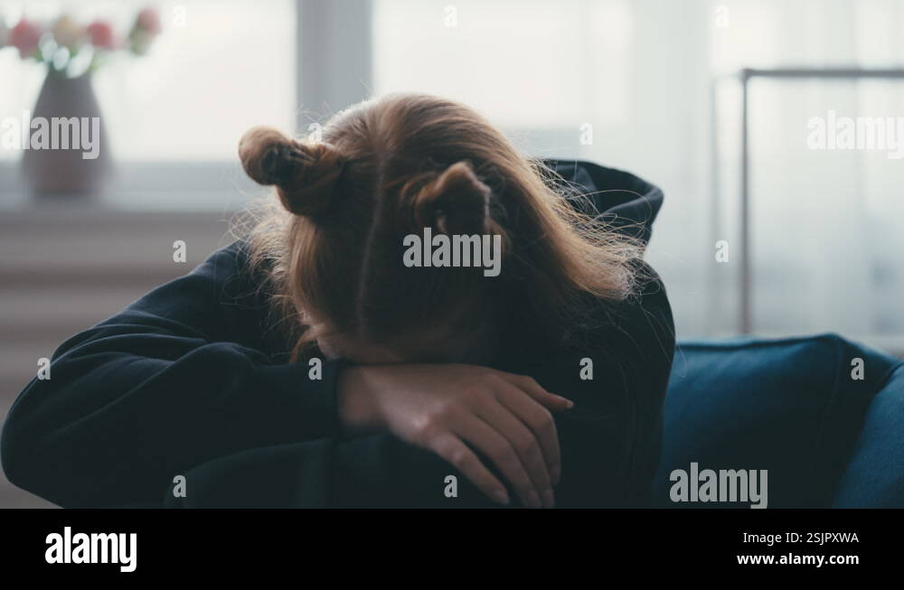 Depressed teen girl crying alone at home, break-up or family problems ...