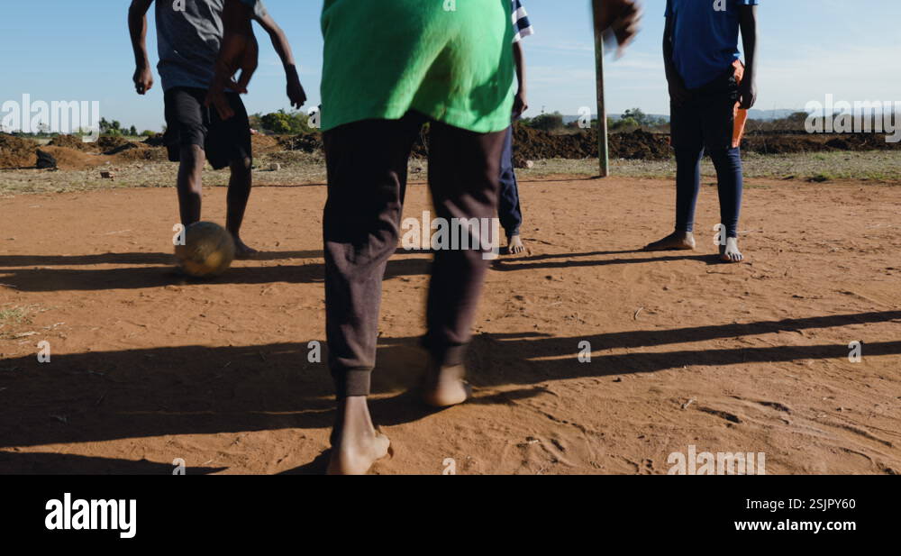 Poverty. Cropped view. Poor Black African children playing soccer in a ...