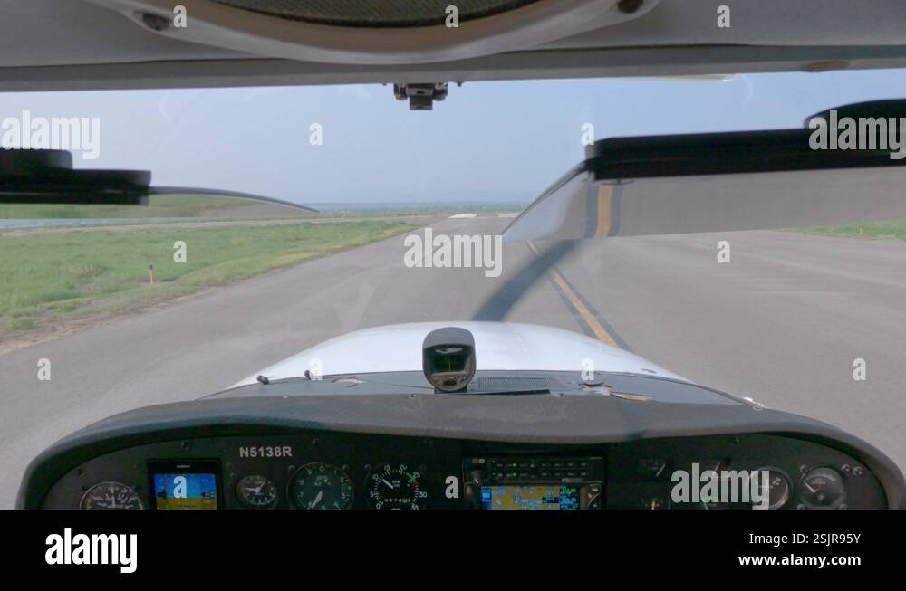 Cockpit view of a small airplane moving from a taxi way to line up with ...