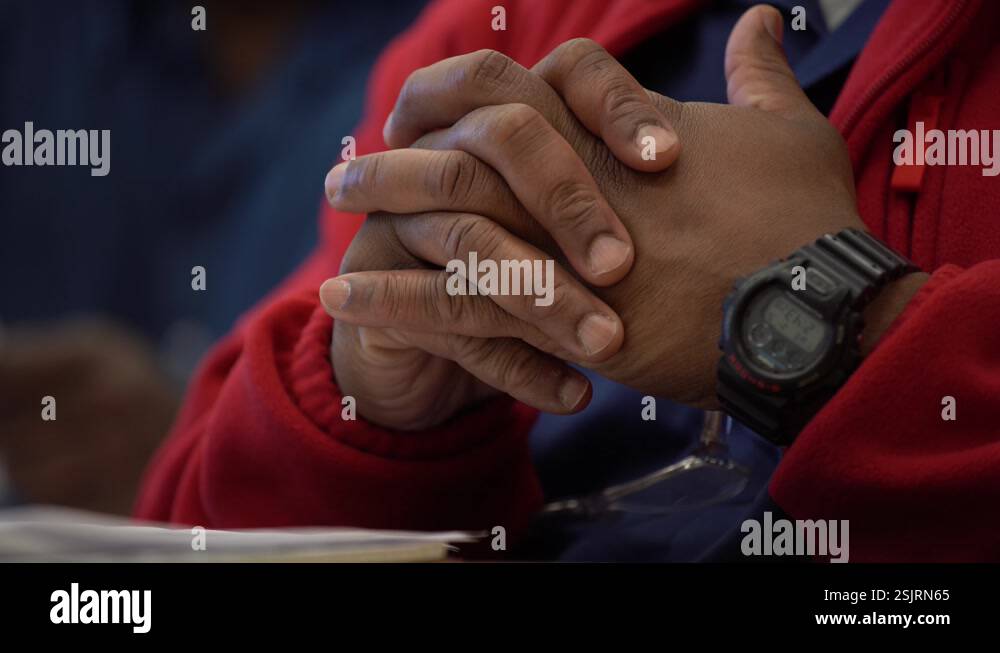 close up african american hands in prison black inmate in jail ...
