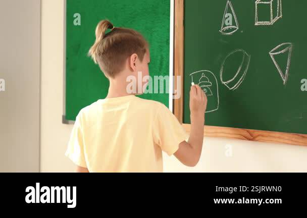Caucasian energetic smart boy drawing picture to express and develop ...