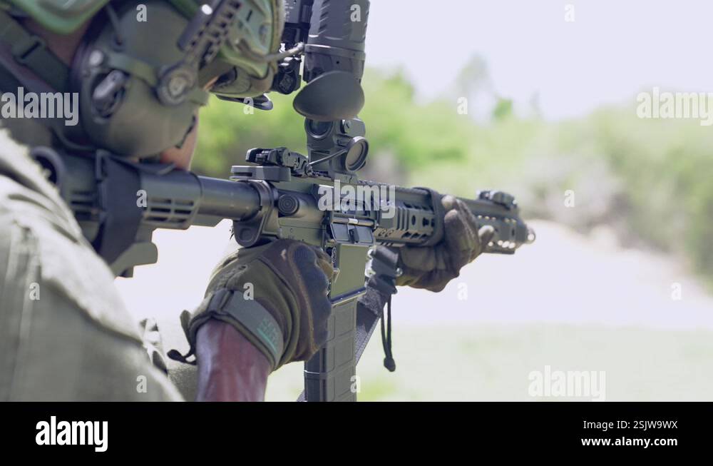 Man aims and shoots tactical assault rifle, anti-terrorism unit trains ...