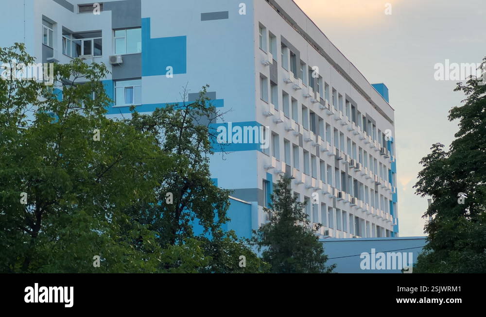 Hospital exterior with transition between buildings. View of the clinic ...