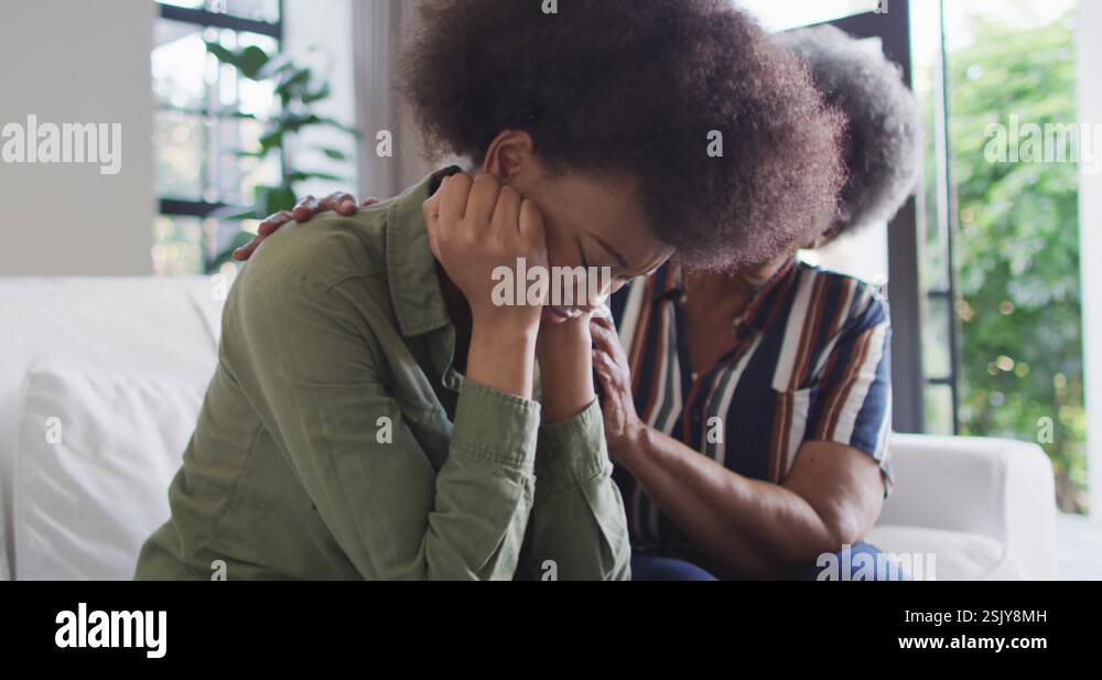Worried african american senior mother comforting sad, crying adult ...