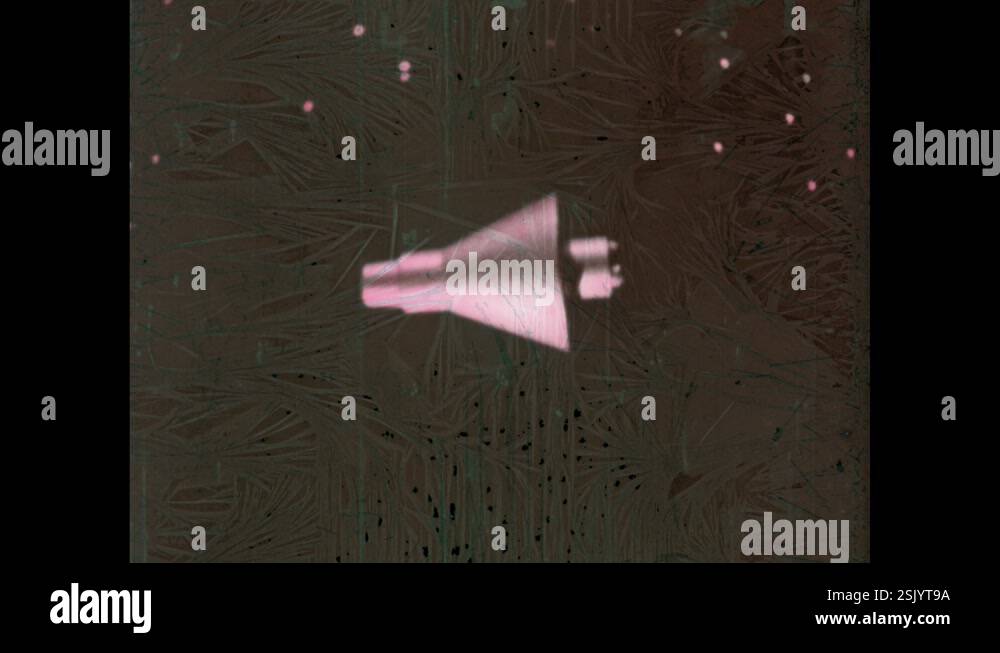 1960s: Rocket in space rotates. View of Earth from space. Satellite ...