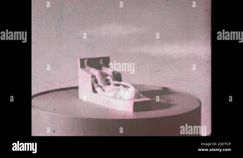 1960s: Rocket on launch pad. Model of astronaut in space capsule ...