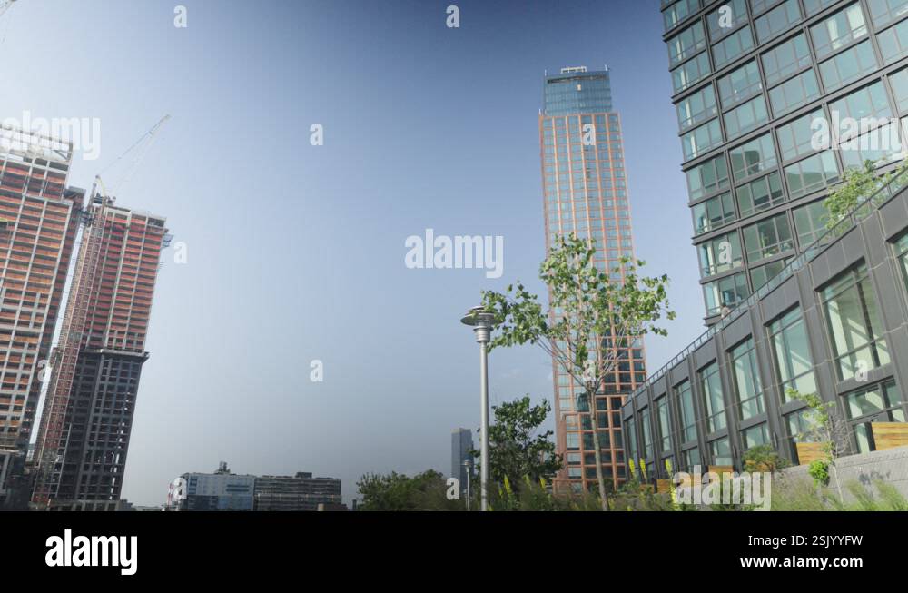 Rising opposite two towering skyscrapers, a high-rise apartment ...