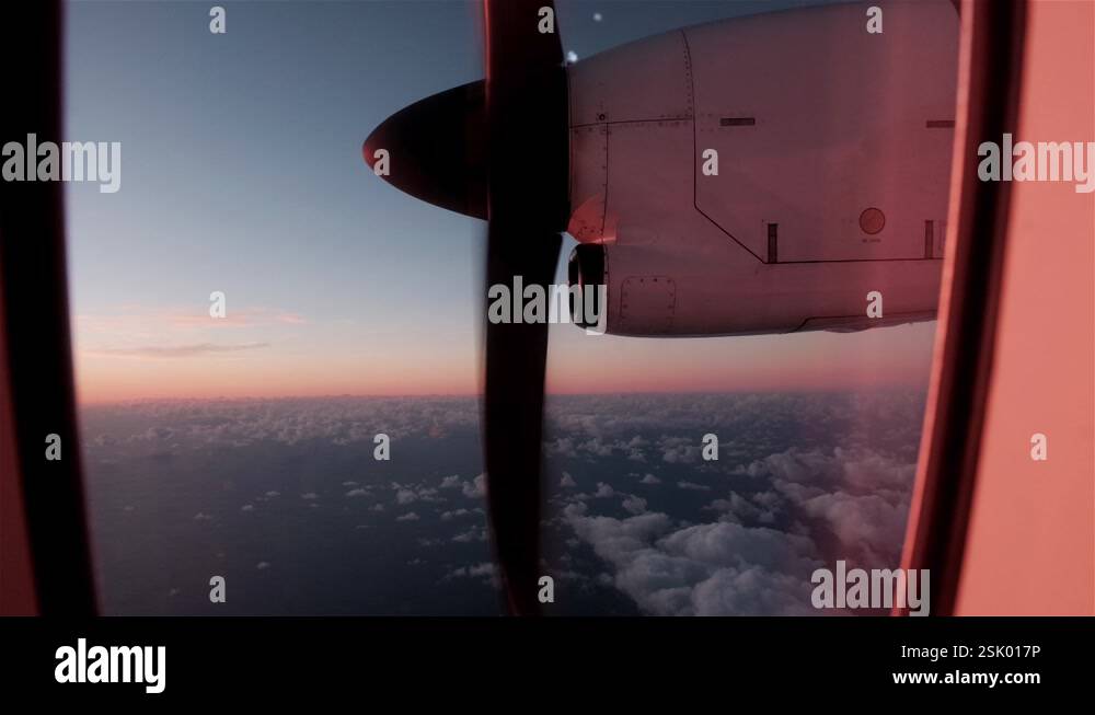 Propeller of a small aircraft through the window of a plane in flight ...