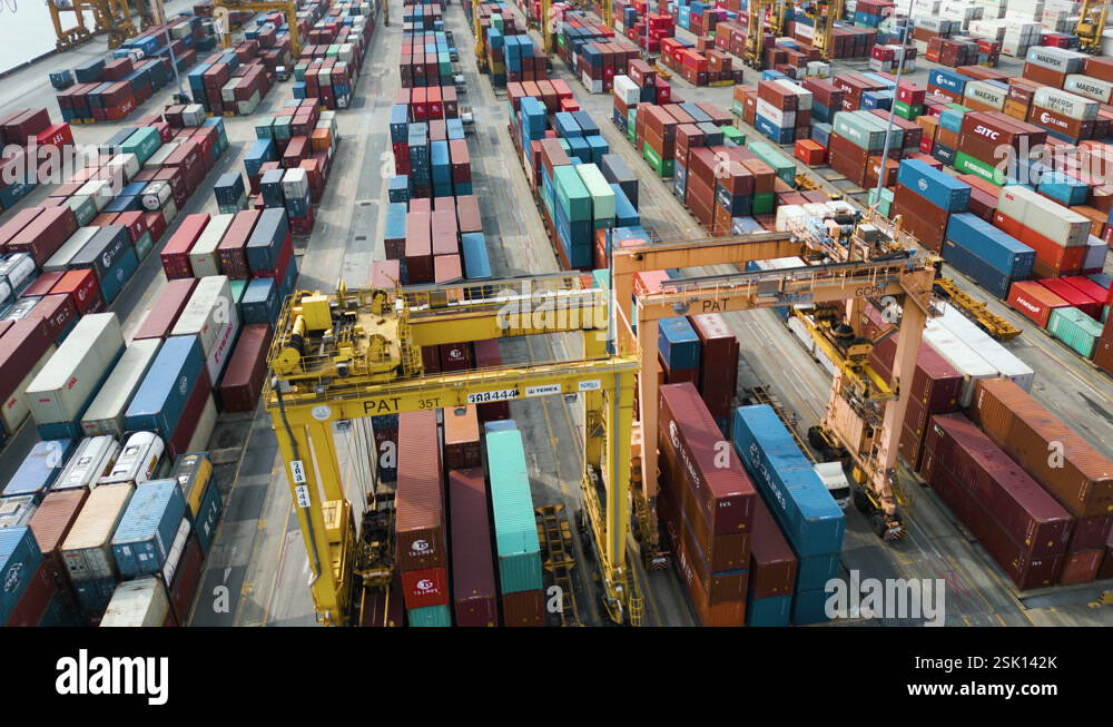 Gantry Cranes moving along Shipping Containers in Big Oversea Trading ...