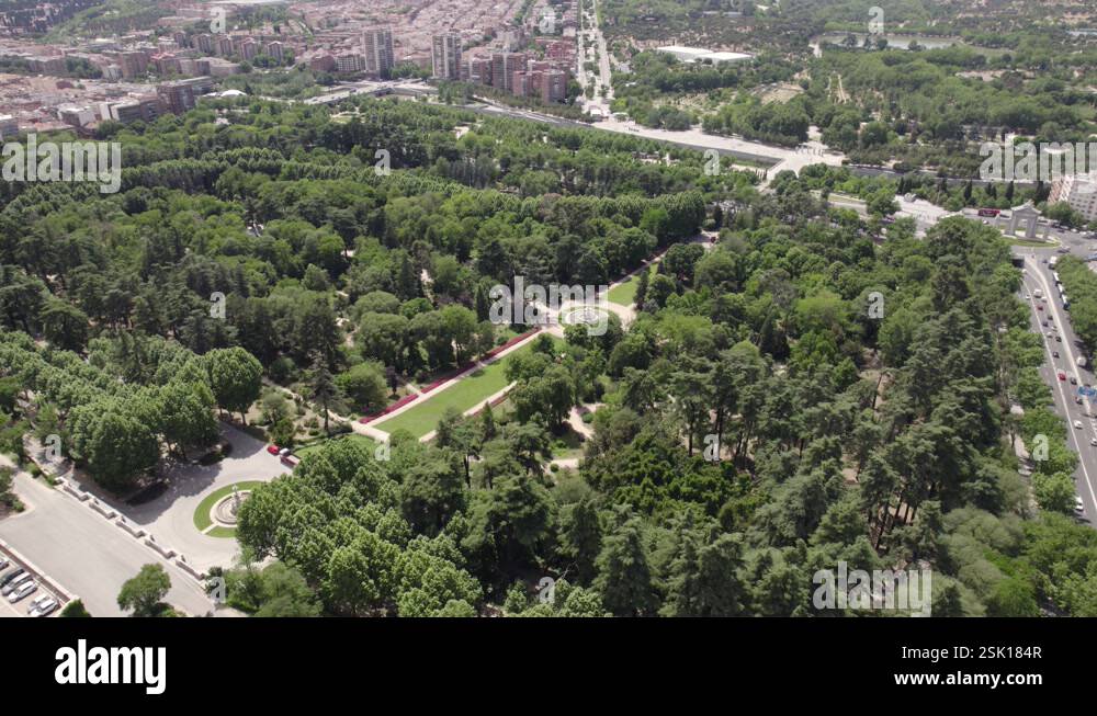 Circling above lush forest with Campo del Moro center, Madrid, Spain ...