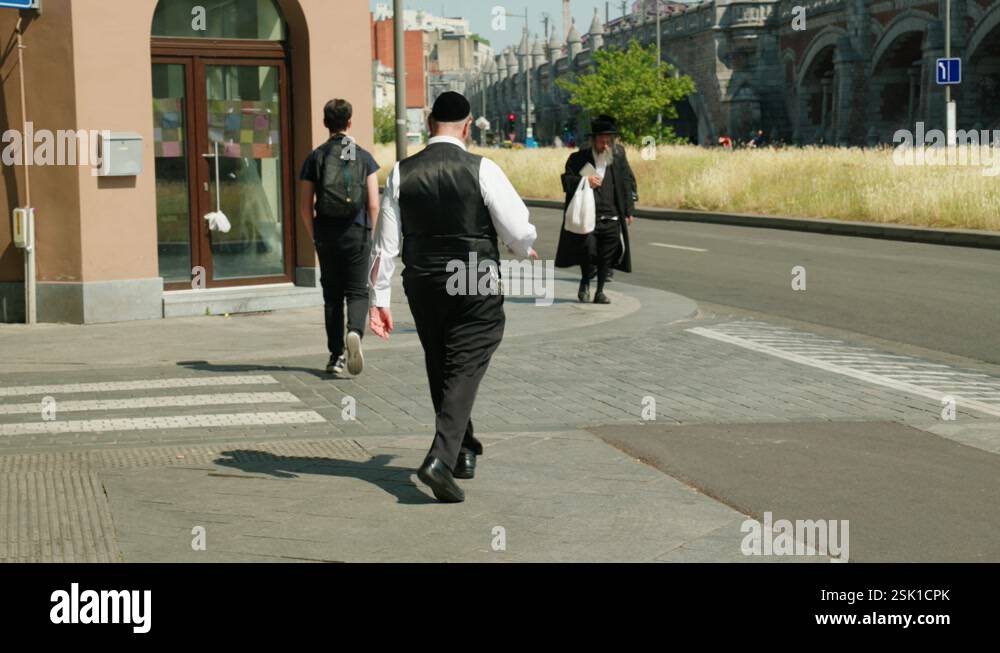 Orthodox Jews greeting each other in the city streets of the Antwerp's ...