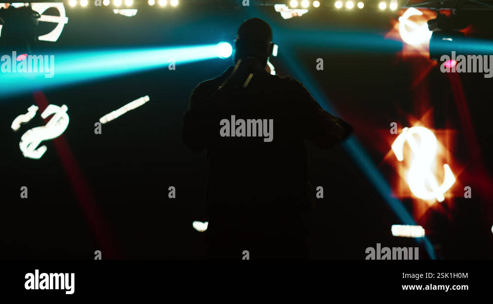 African-American Black rap artist performing his gig on a stage of a ...