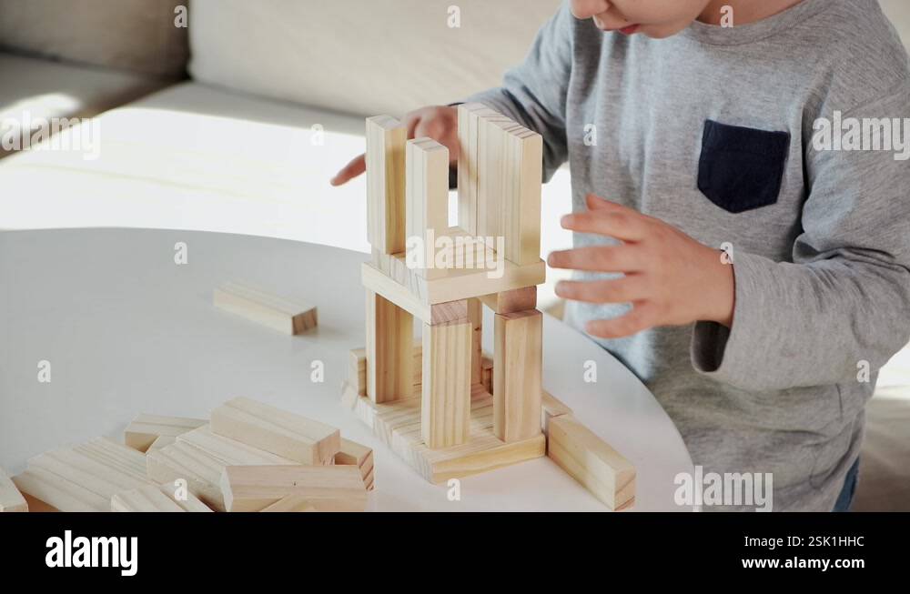 Child build tower from wooden Stock Videos & Footage - HD and 4K Video ...