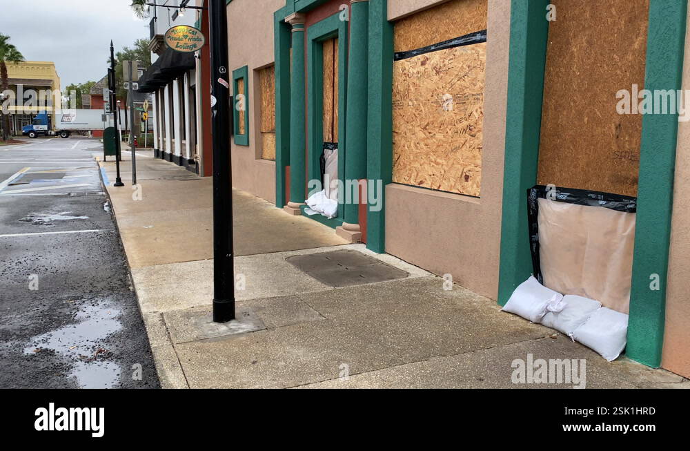 Preparing for hurricane landfall boarding up windows and sandbags ...
