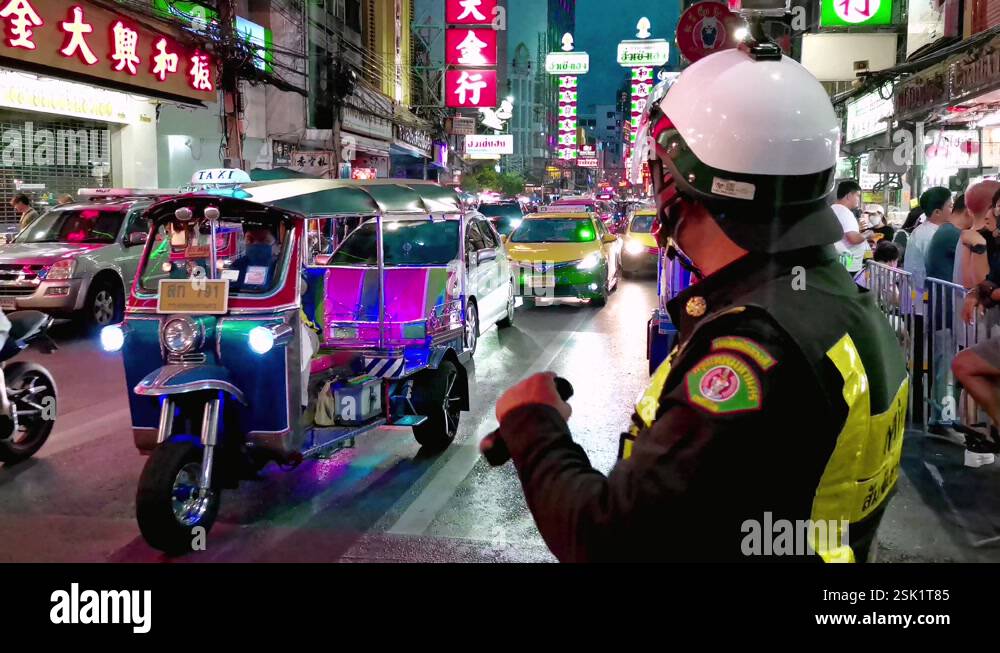 Thai Traffic Police Officer in Bangkok's Chinatown at Night Waving on ...