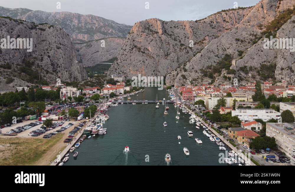 Boats, Yachts and Car Parking lots at wharf (port) of Cetina River ...