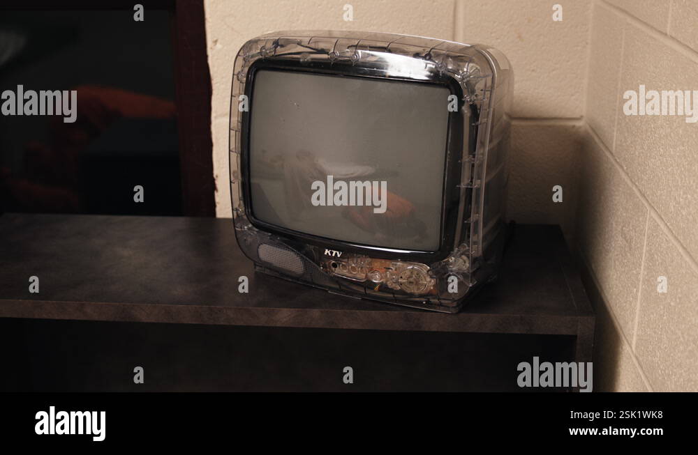 Reflection in prison cell TV screen of prisoner, convict, inmate in ...