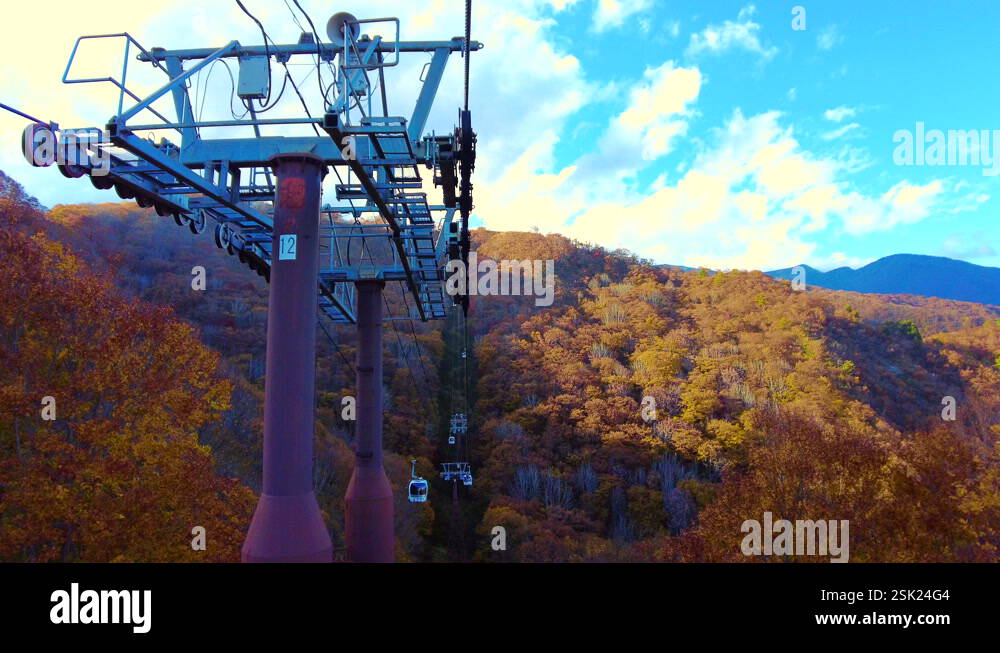 POV of autumn landscape of Mt. Hakuba from moving gondla lift, Japan ...