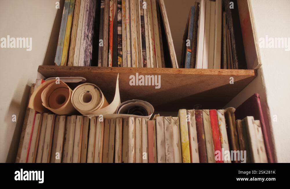 Shelving in the artist's studio for storing canvases and paintings. Art ...