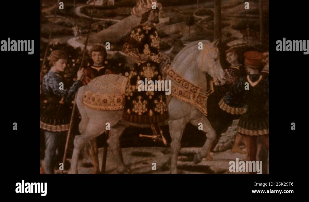 1950s: Men in medieval uniforms carry staves near king riding horse in ...