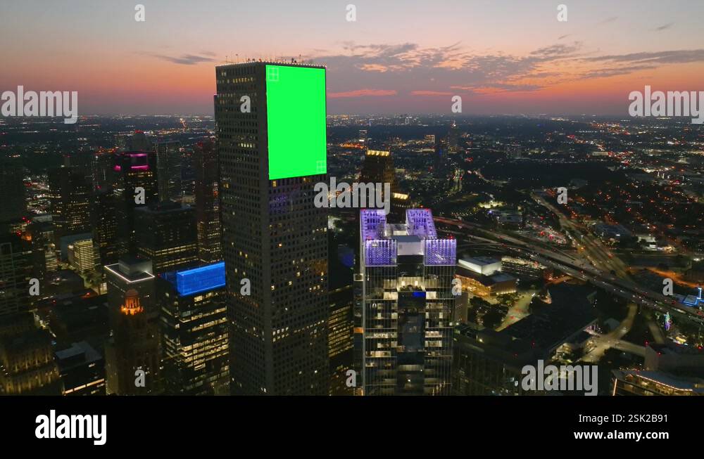Chroma key mark on a building wall, colorful evening city background ...