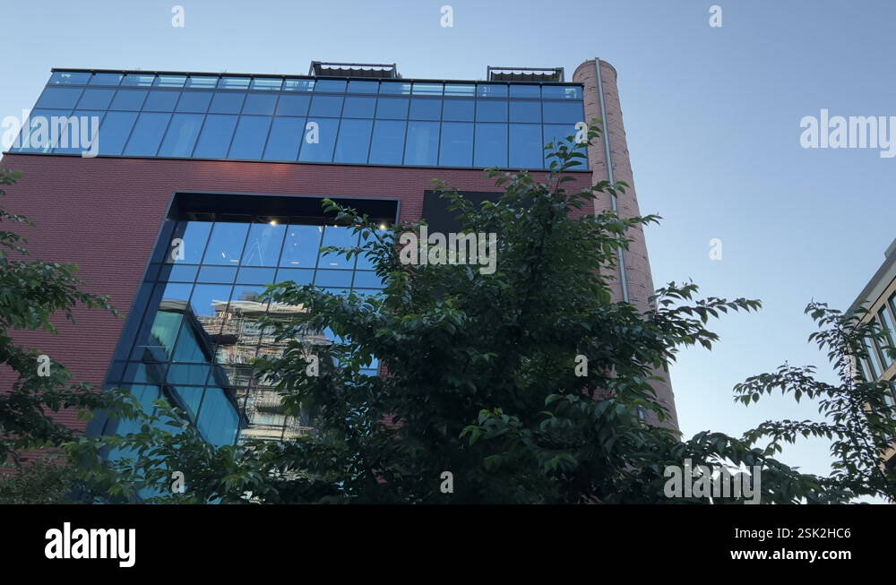 Modern factory office building with brick chimney after renovation ...
