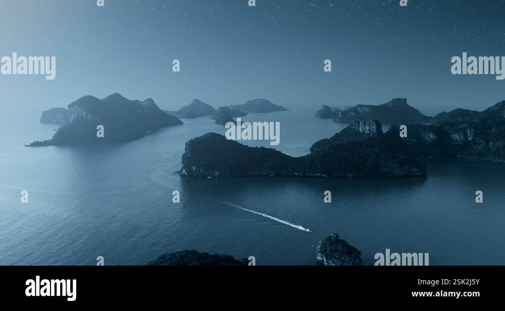 Lonely speed boat in night sea. Aerial moonlight island mountain ...