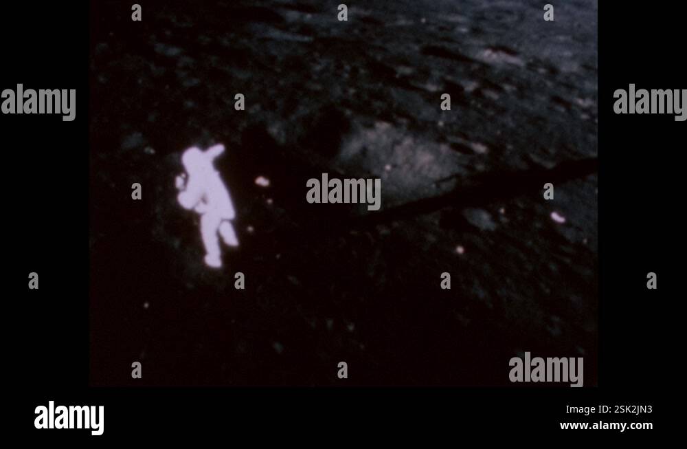 1960s: Astronaut walks across surface of moon Stock Video Footage - Alamy