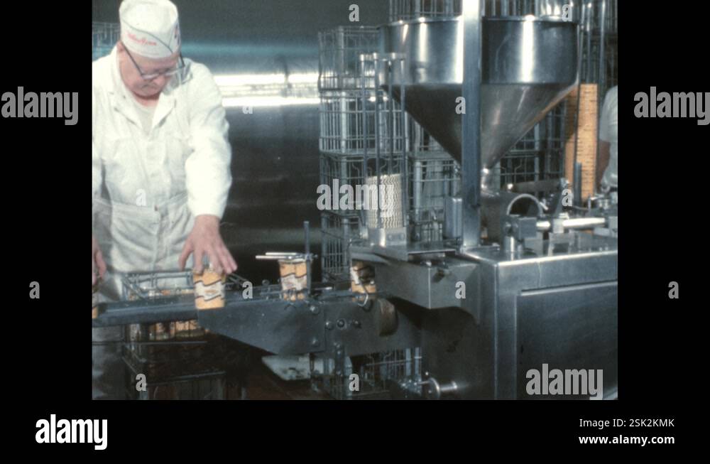 1960s: At factory, a man in white uniform takes ice-cream cartons off ...