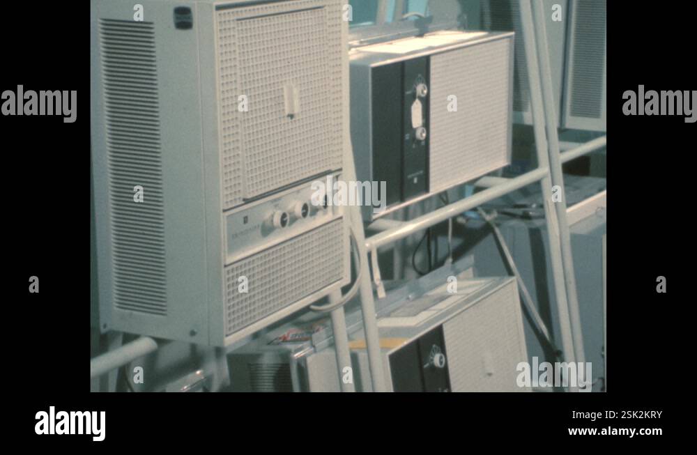 1960s: Air conditioners stand on display in appliance store showroom ...