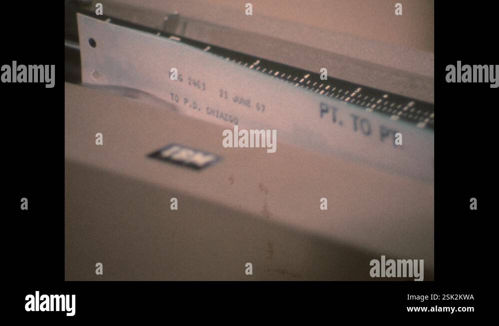 1960s: Printer head moves on teletype printer. Teletype prints text on ...