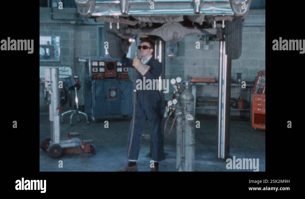 1960s: Mechanic cutting part of a car with the torch Stock Video ...