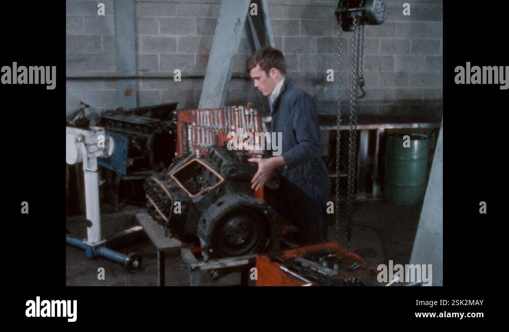 1960s: Mechanic assembling parts of the engine Stock Video Footage - Alamy