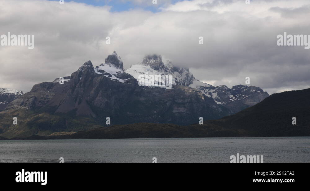 Heavy clouds cover the Darwin Range in the Patagonian fjords, Tierra ...