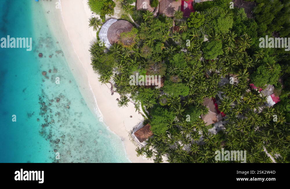 Drone top-down view of Aloita Resort bungalows in Simakakang Island ...