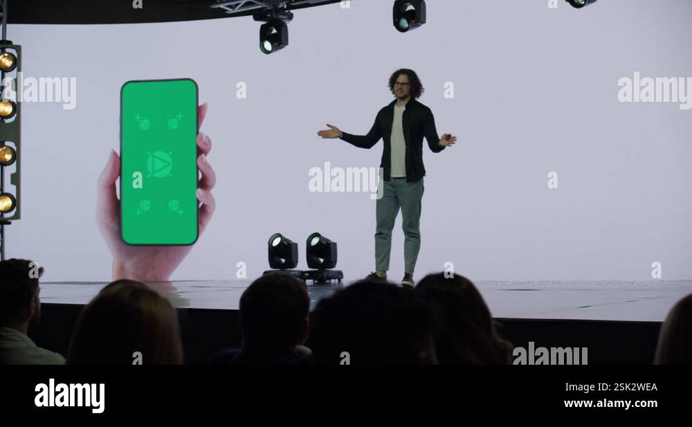 Man presenting a new technological product or application launch on a ...