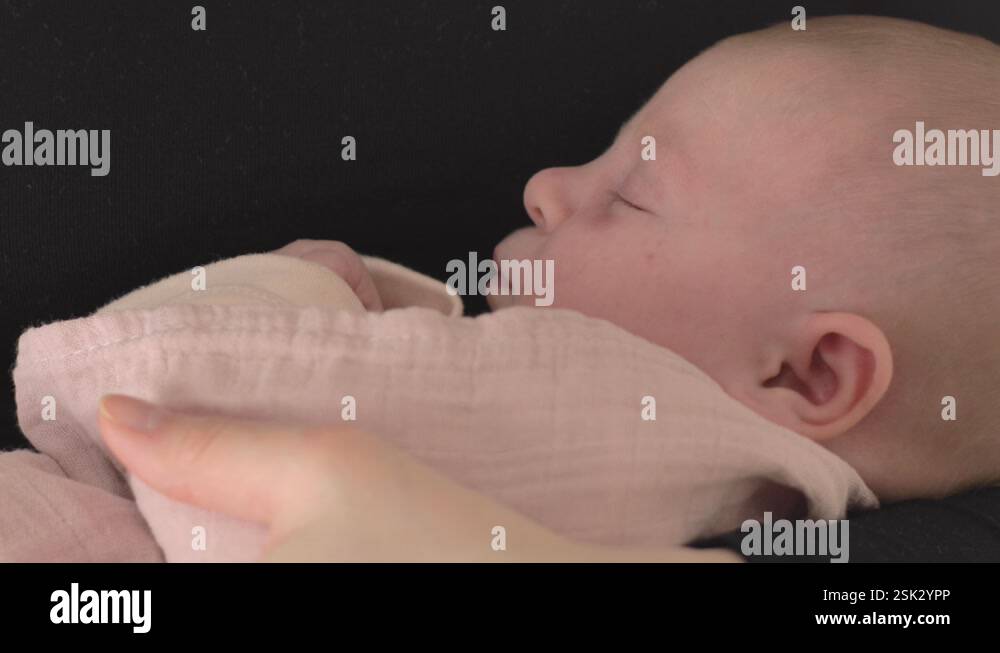 Close-up of a newborn baby being rocked by their mother Stock Video ...