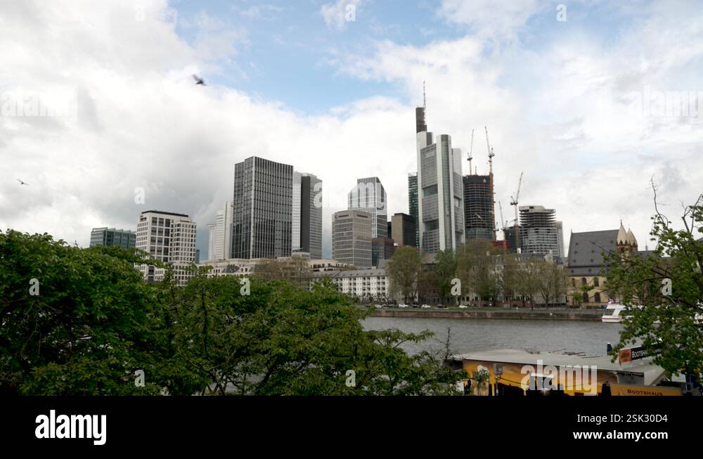 Frankfurt Skyline View From Across River Main Over Tree Line With Light ...