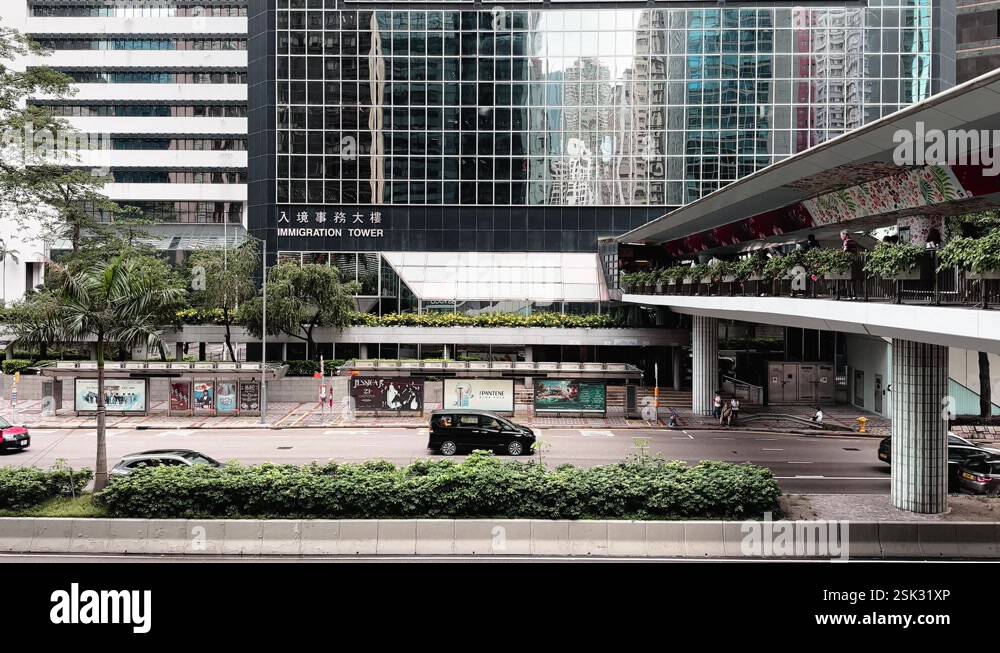 Hong Kong Immigration tower logo and cityscape reflection on windows ...