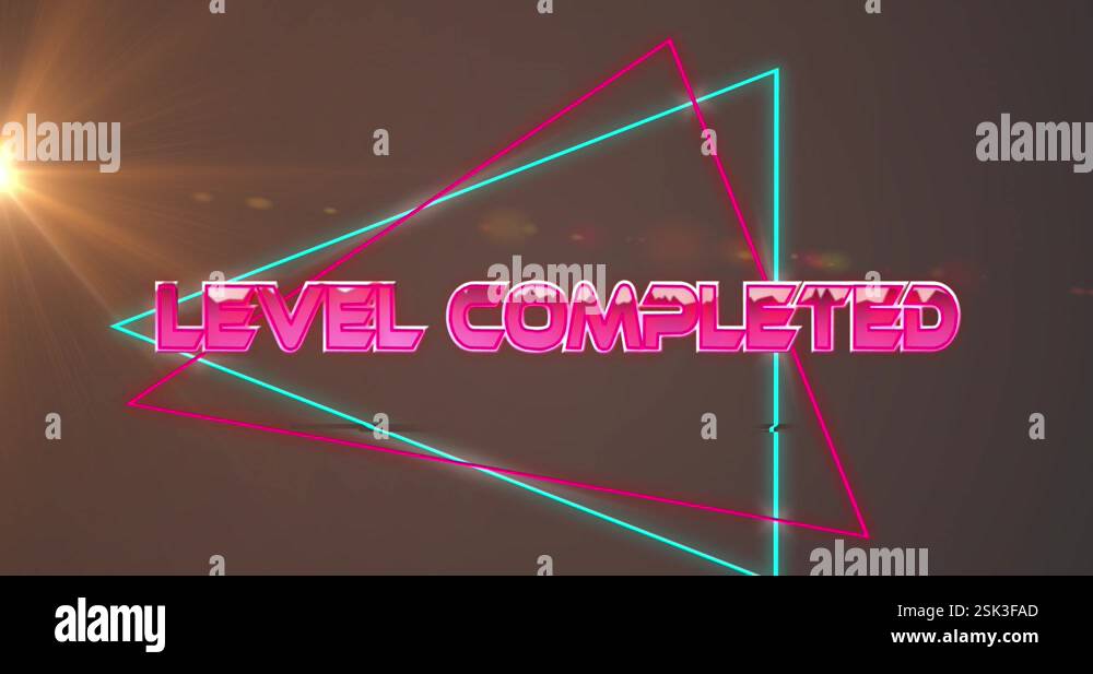 Animation of level completed text banner against orange light spot on ...