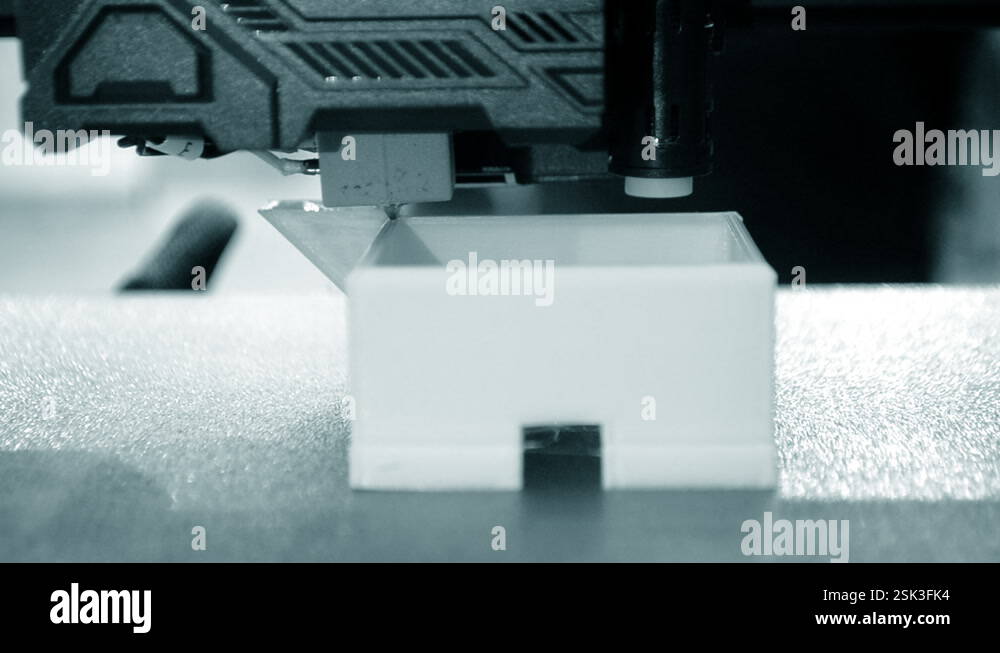 3D printer printing close-up Process creating three-dimensional model ...